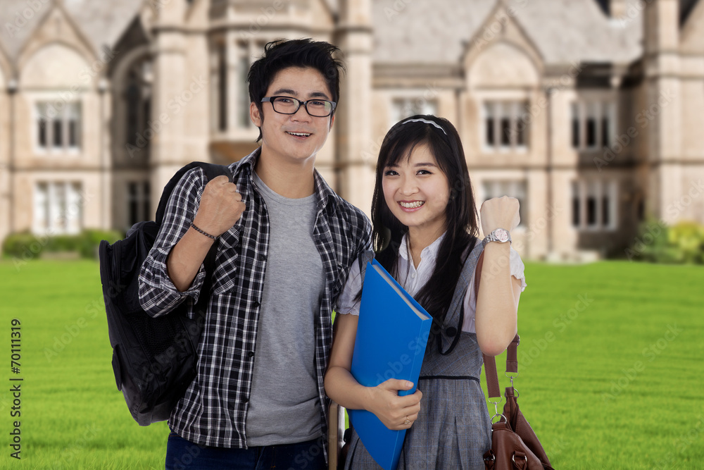 Two attractive students expressing success Stock Photo | Adobe Stock