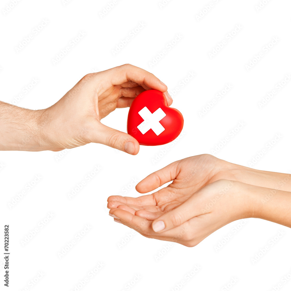 hand giving heart with red cross symbol Stock Photo | Adobe Stock