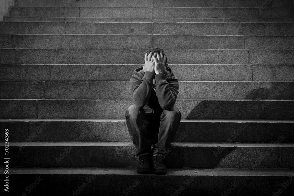Young homeless man depressed sitting on street stairs crying Stock ...