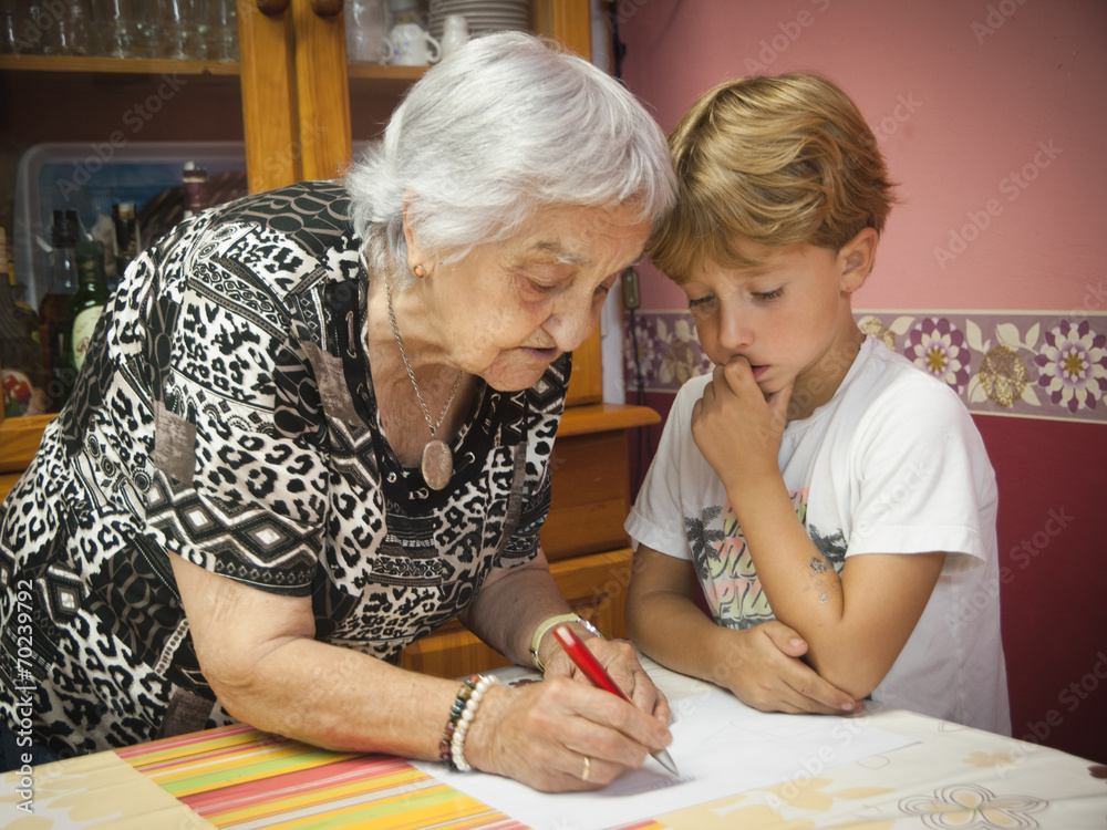 Grandma teaches her great-grandson Stock Photo | Adobe Stock