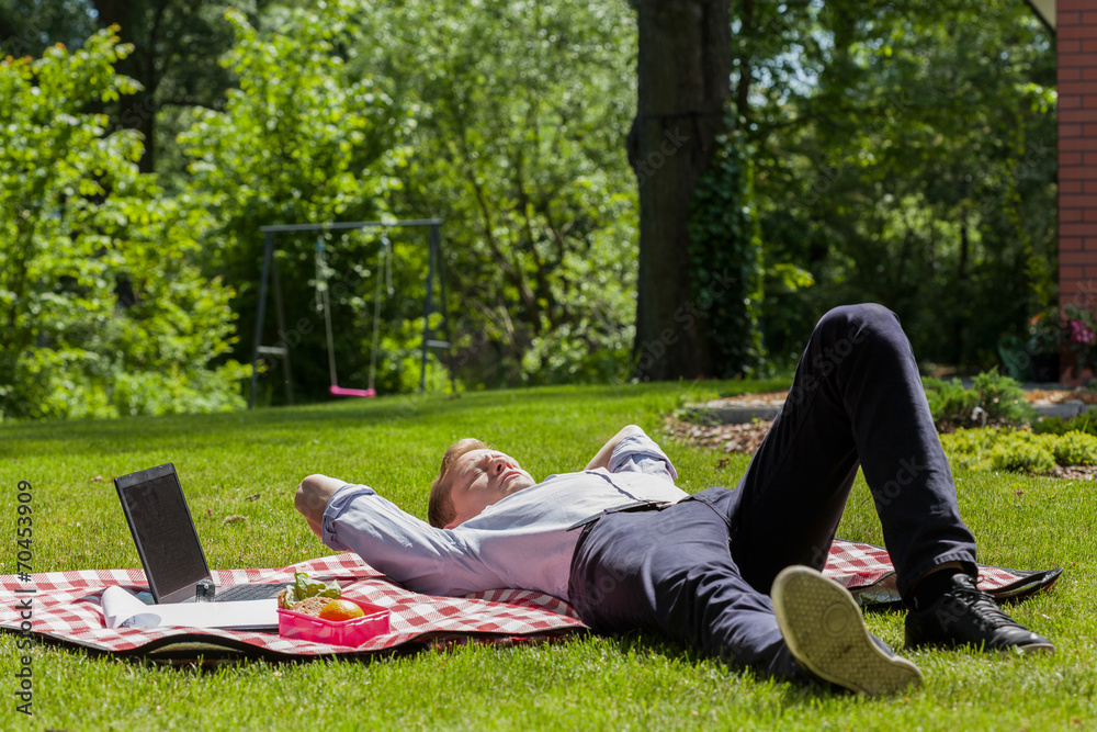 Working man resting in garden Stock Photo | Adobe Stock