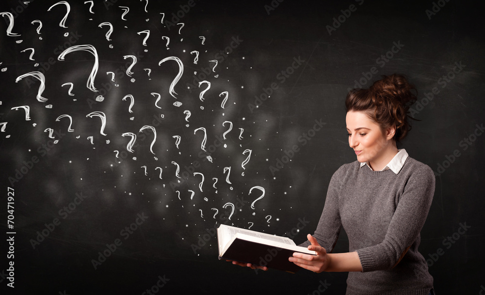 Pretty woman reading a book with question marks coming out from Stock ...