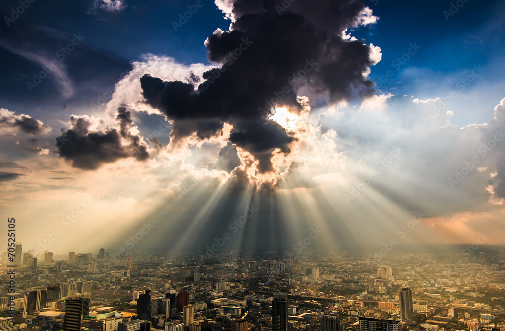 Rays of light shining through dark clouds Stock Photo | Adobe Stock