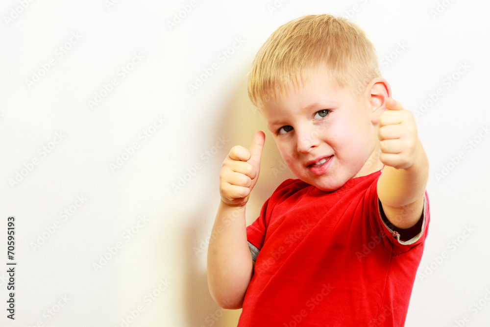 Little boy showing thumb up success hand sign gesture. Stock Photo ...