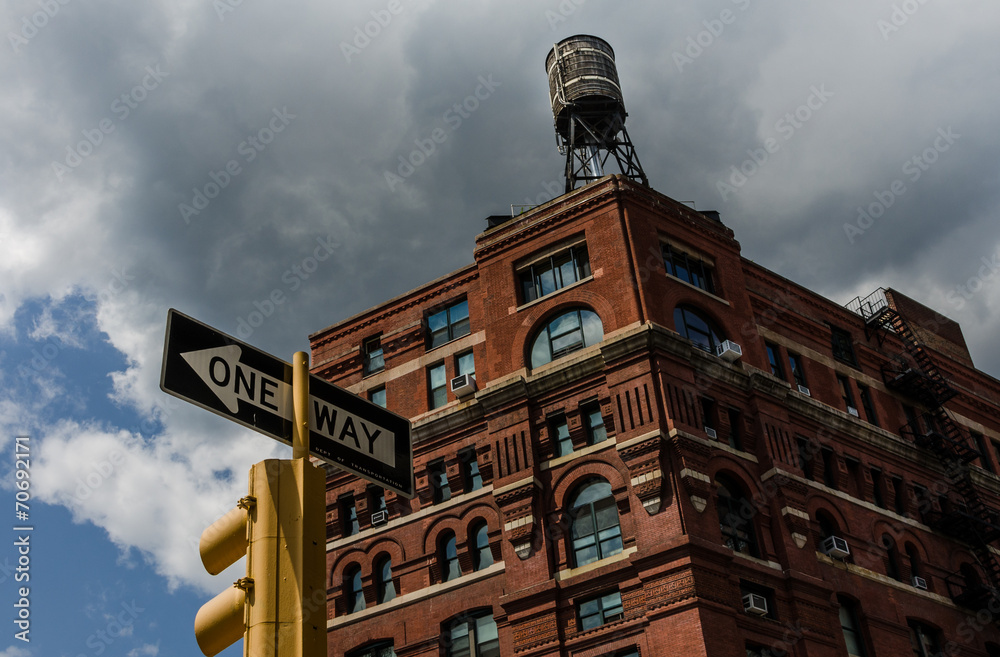 Historic brick building in New York City with water tower Stock Photo ...