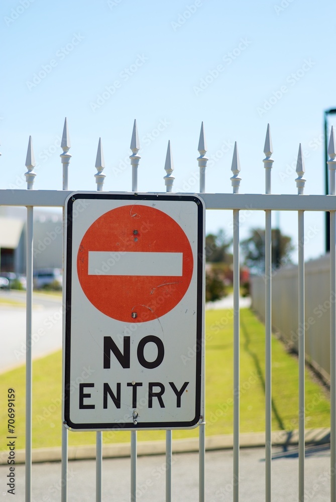 No entry sign on a metal fence with spikes Stock Photo | Adobe Stock