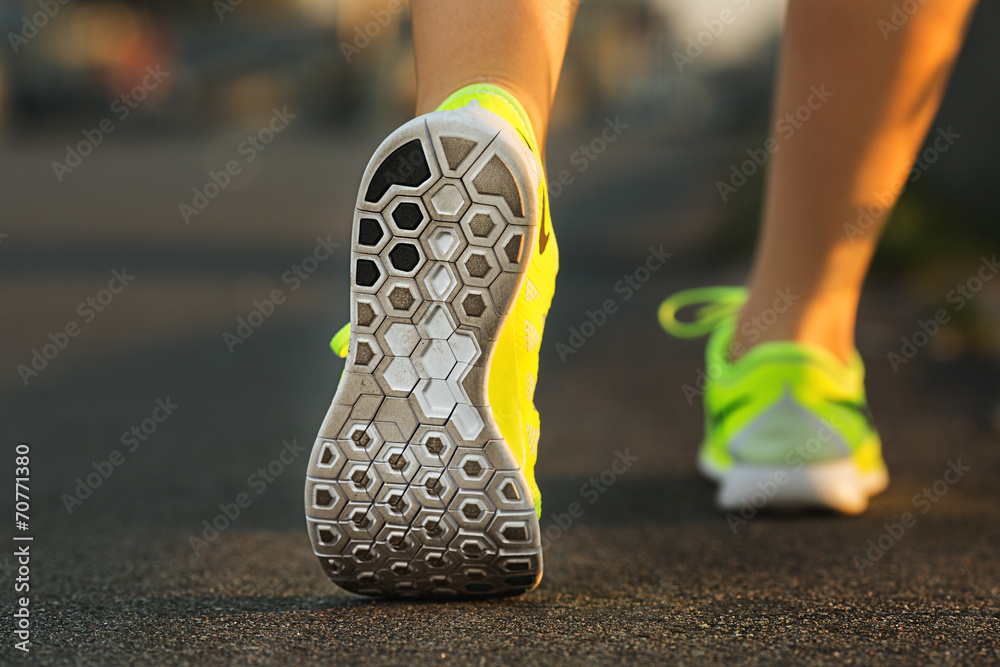 Runner woman feet running on road closeup on shoe. Stock Photo | Adobe ...