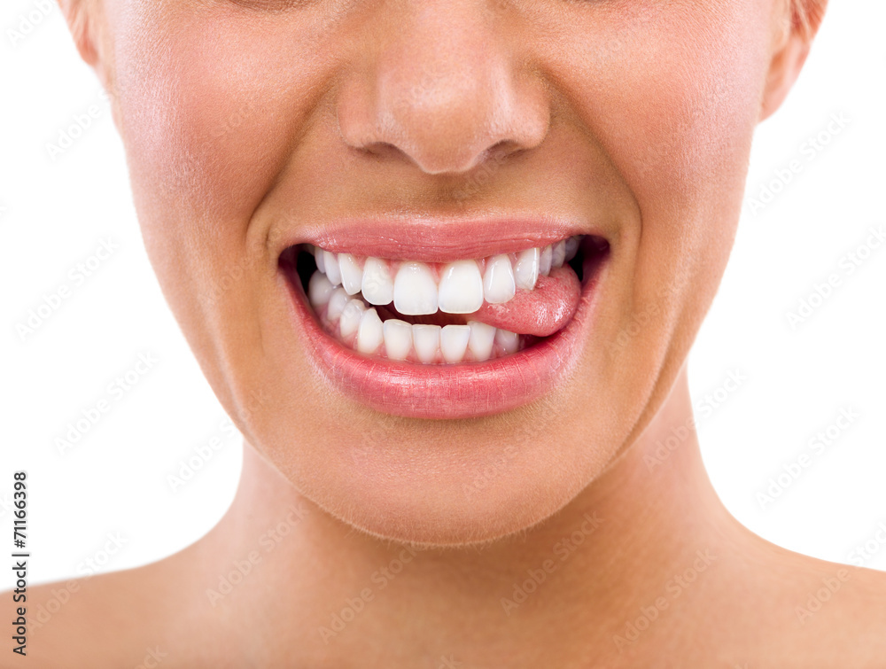 Female biting tongue with perfect teeth Stock Photo | Adobe Stock