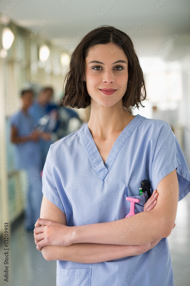 Portrait of a female nurse standing with her arms crossed Stock Photo ...