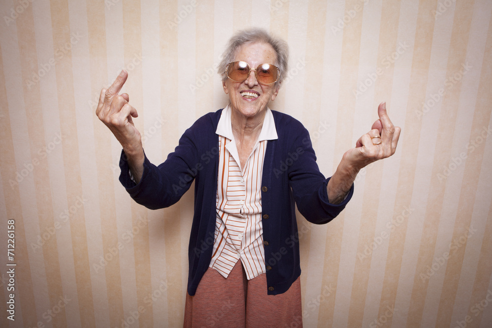 cool elder lady making middle finger sign Stock Photo | Adobe Stock