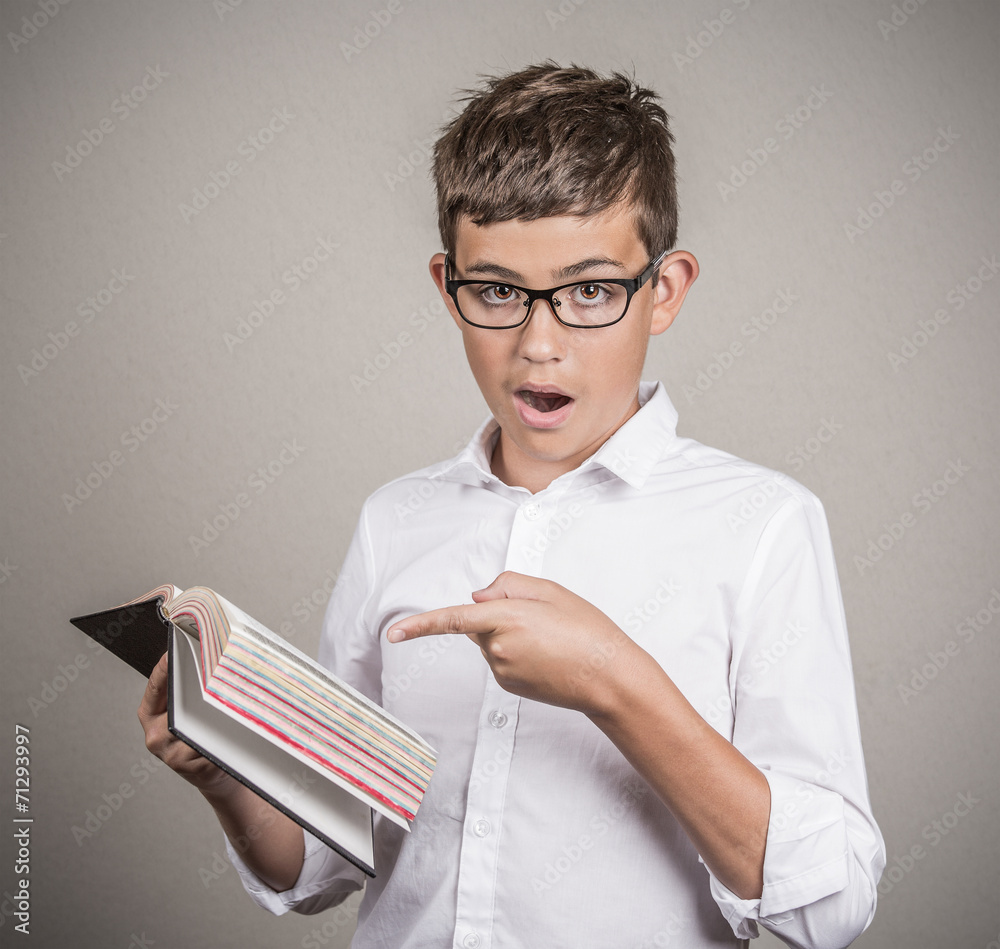 young man pointing at book page, shocked face expression Stock Photo ...
