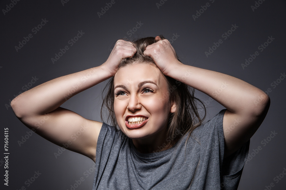 Angry woman screaming over dark grey Stock Photo | Adobe Stock