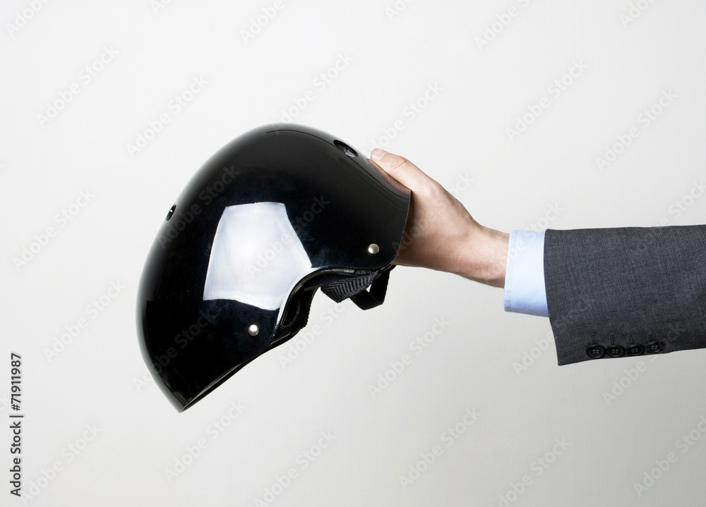 business man holding a helmet, side view, Safe business concept Stock ...