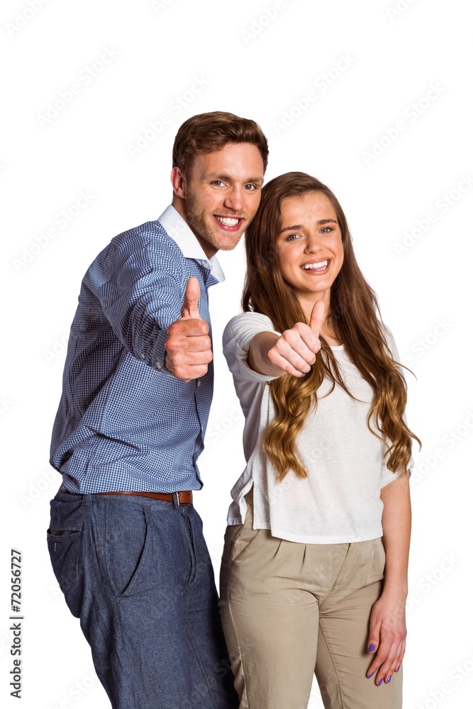 Happy couple gesturing thumbs up Stock Photo | Adobe Stock