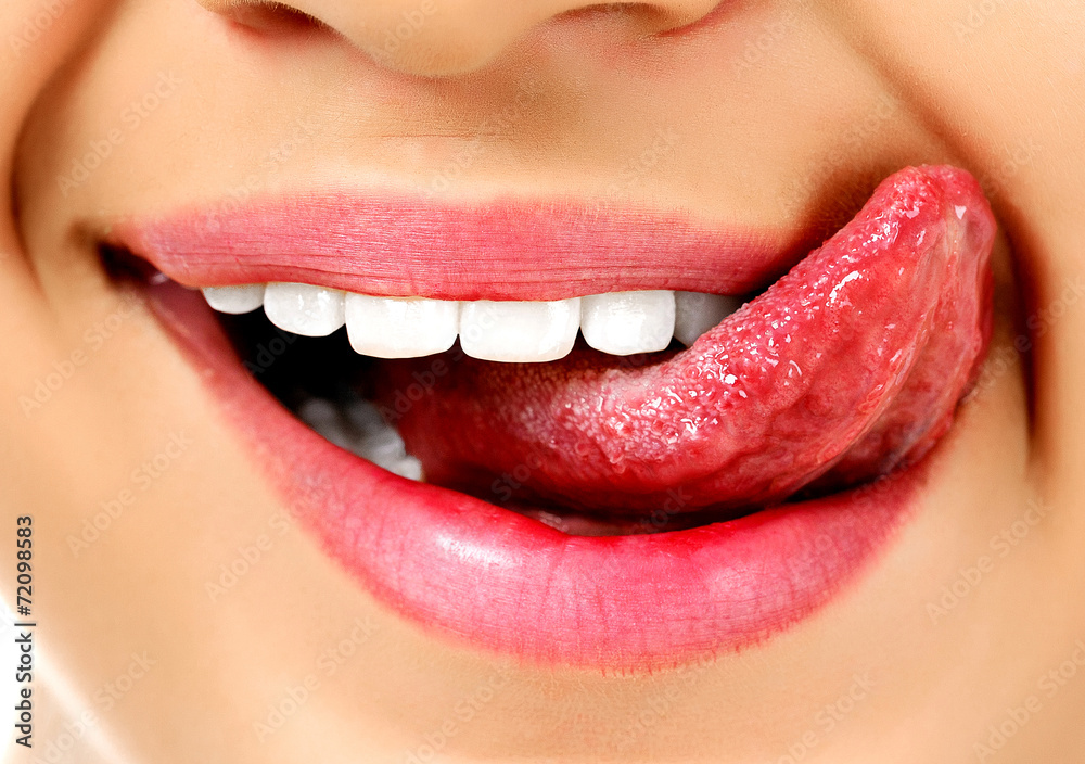 Licking lips. Close-up of young woman licking lips Stock Photo | Adobe ...