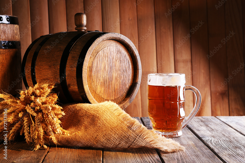 Beer barrel with beer glass on table on wooden background Stock Photo ...