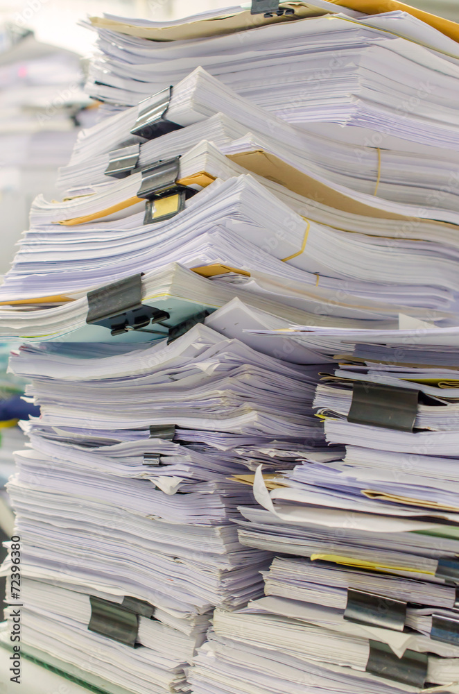 Pile of documents on desk stack up high waiting to be managed Stock ...
