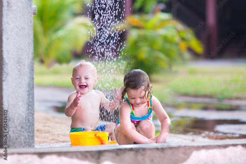 Kids in an outdoor shower Stock Photo | Adobe Stock