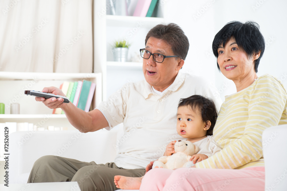 Asian family watching tv Stock Photo | Adobe Stock