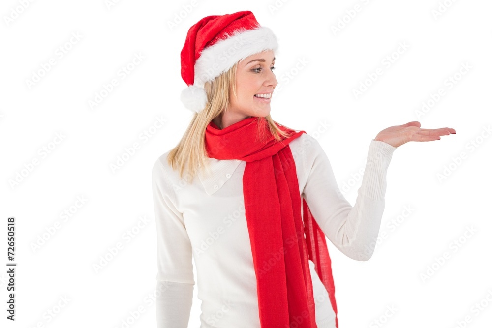 Festive blonde holding hand out Stock Photo | Adobe Stock