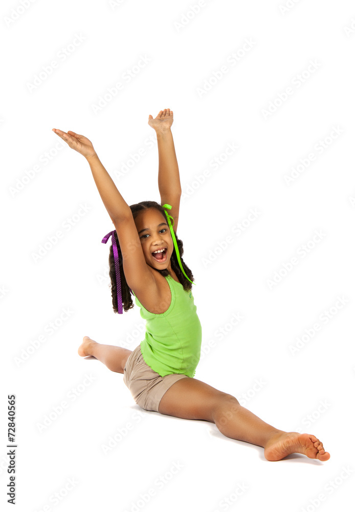 girl is engaged in gymnastics. child sitting on the splits. Stock Photo ...