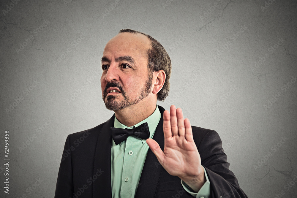 grumpy man with bad attitude giving talk to hand gesture Stock Photo ...