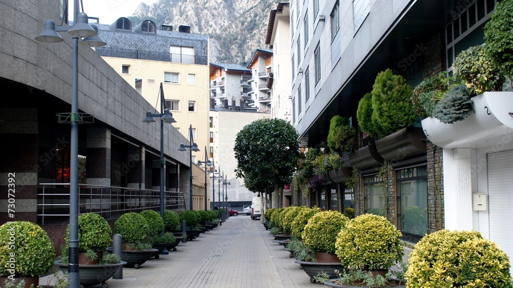 Clear street in Andorra-la-Vella with buildings and bushes. Stock Photo ...