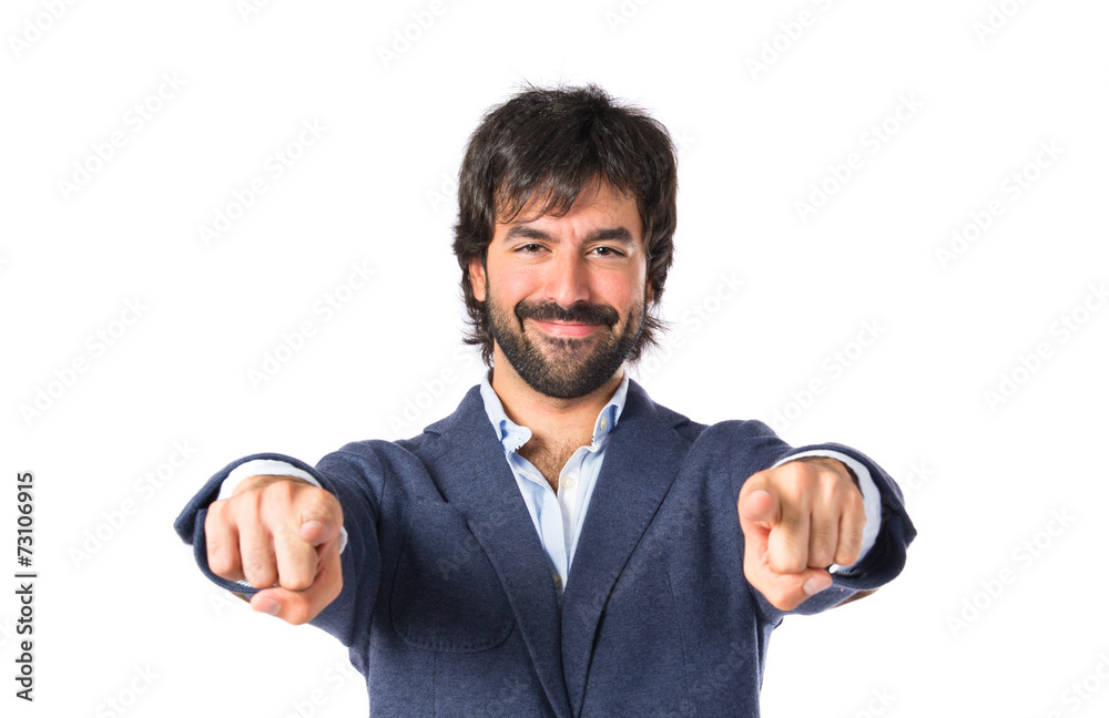 Businessman pointing to the front over white background Stock Photo ...