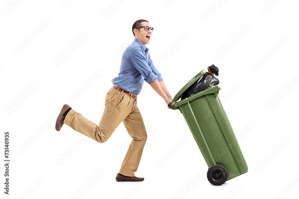 An excited man pushing a garbage can Stock Photo | Adobe Stock