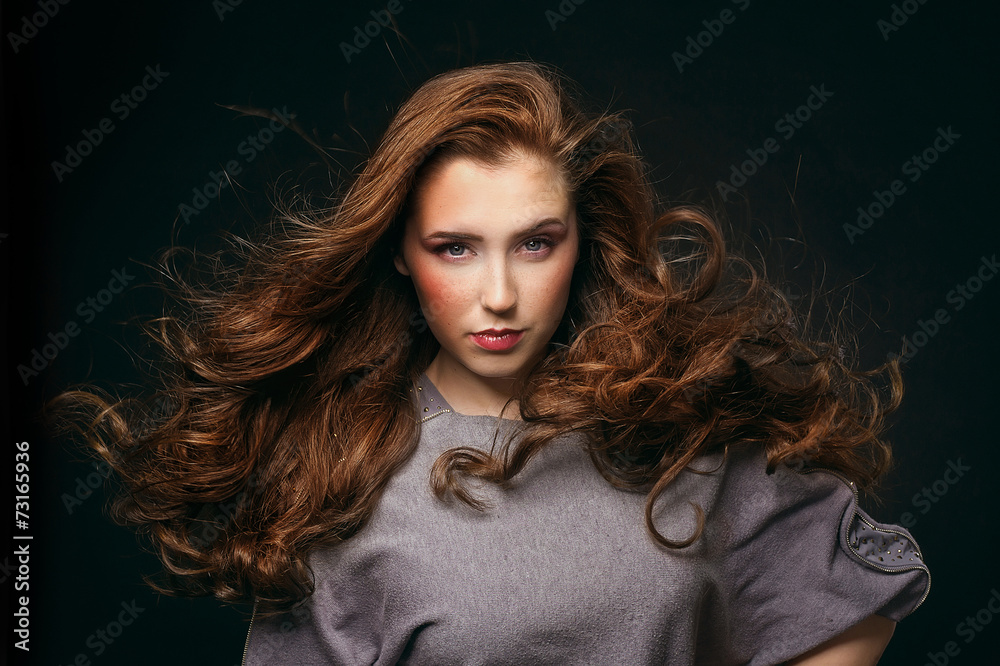 Portrait of young beautiful woman with long flowing hair Stock Photo ...