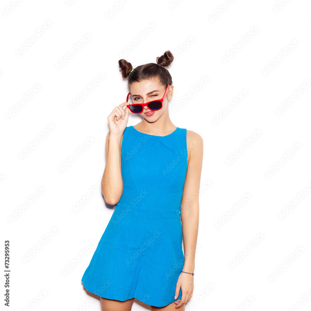 Young Woman with sunglasses winking Stock Photo | Adobe Stock