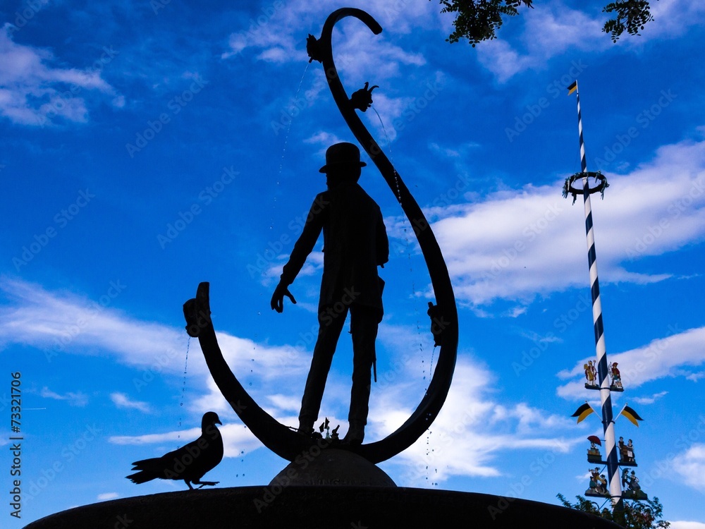Karl-Valentin-Brunnen mit Taube und Maibaum Stock Photo | Adobe Stock