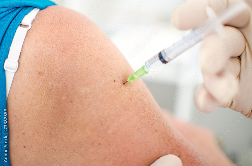 Doctor making an injection Stock Photo | Adobe Stock