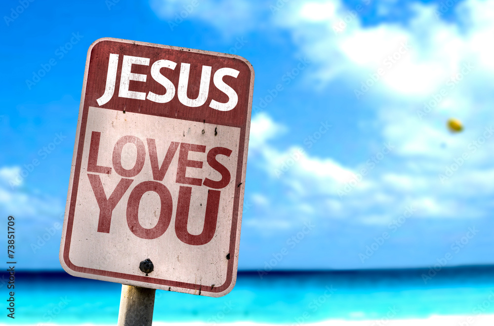 Jesus Loves You sign with a beach on background Stock Photo | Adobe Stock