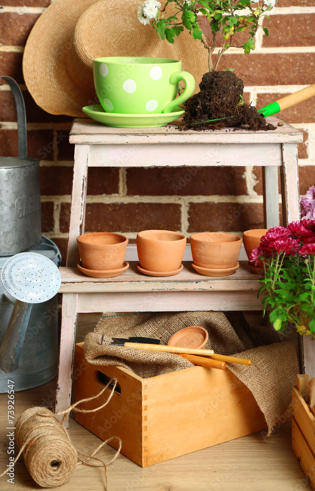 Flowers in wooden box, pots and garden tools Stock Photo | Adobe Stock