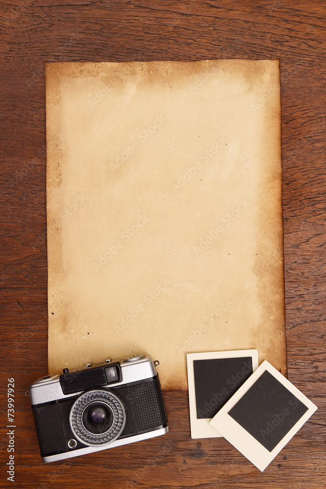 Old paper and vintage photo frame with camera. Stock Photo | Adobe Stock