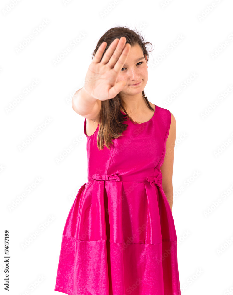 Girl making stop sign over white background Stock Photo | Adobe Stock