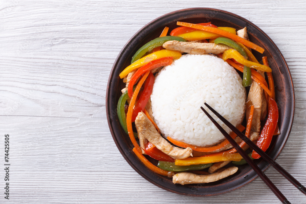 Rice with chicken, vegetables and chopsticks top view Stock Photo ...