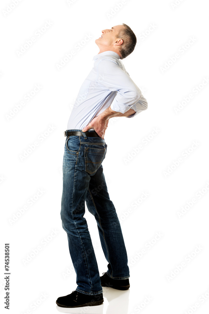 Full length side view mature man with back pain Stock Photo | Adobe Stock