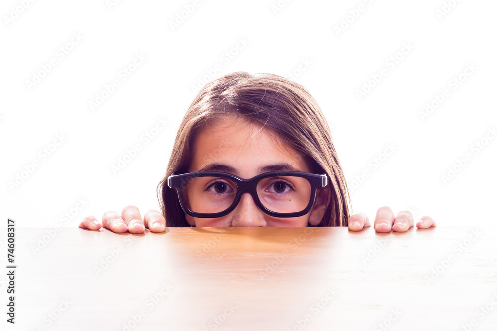 little girl hiding behind a table Stock Photo | Adobe Stock