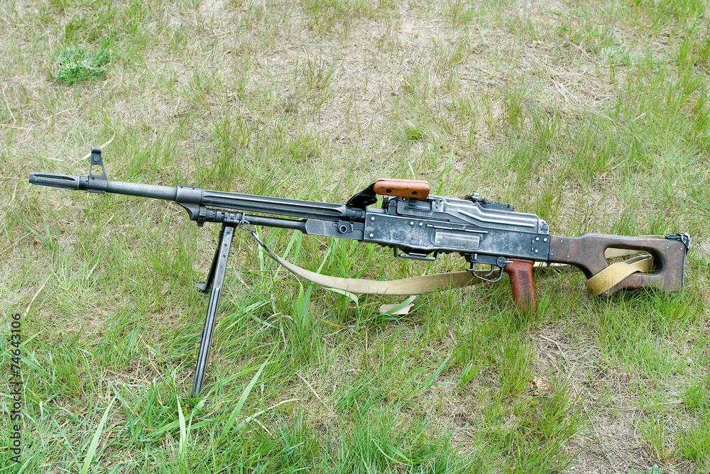 7.62mm. Kalashnikov machine gun on the grass. Stock Photo | Adobe Stock