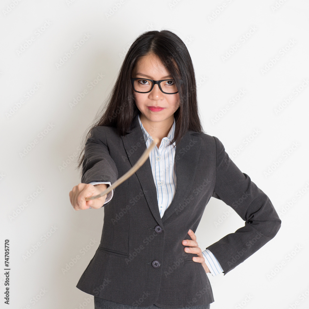 Asian female teacher holding a stick Stock Photo | Adobe Stock