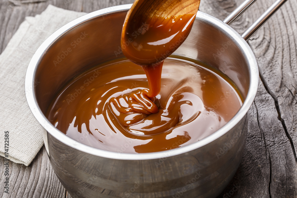 liquid caramel in a saucepan Stock Photo | Adobe Stock