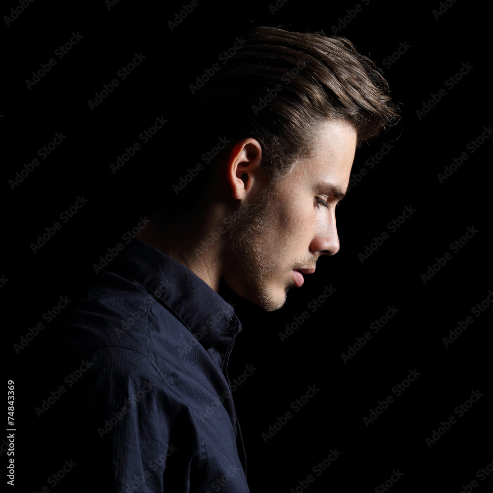 Profile of a sad man face crestfallen on black Stock Photo | Adobe Stock
