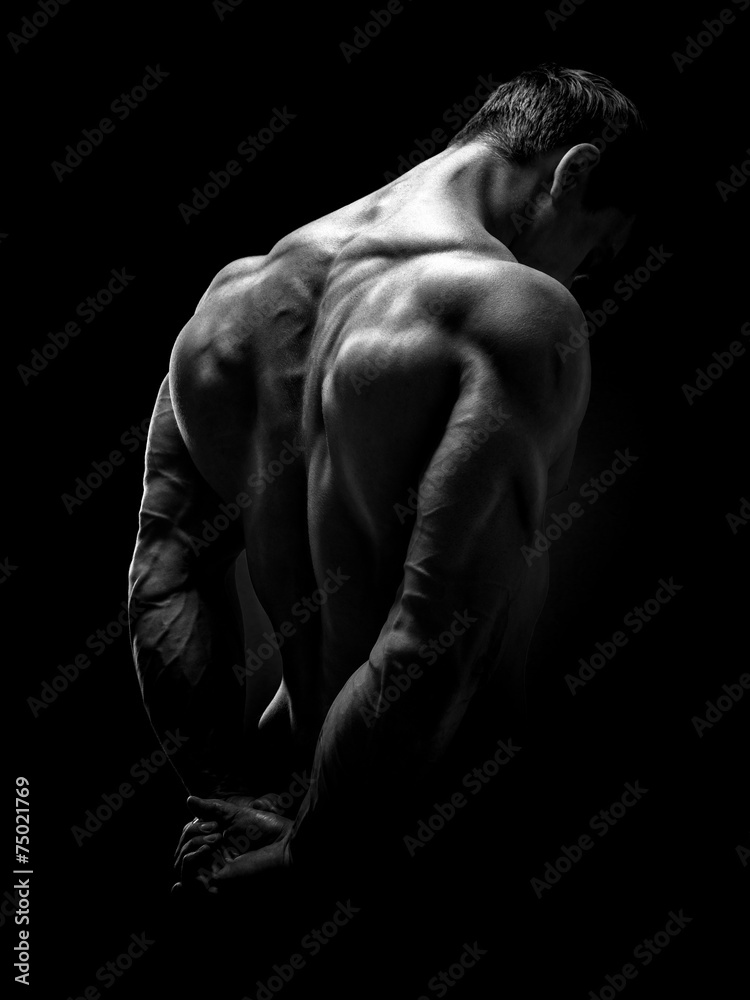 Handsome muscular bodybuilder turned back Stock Photo | Adobe Stock