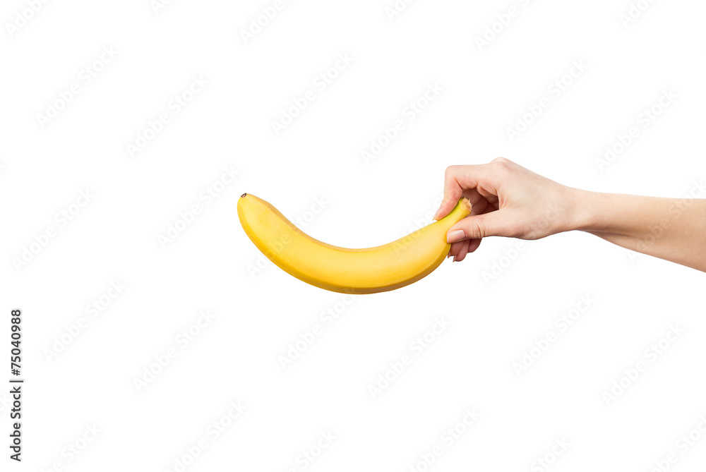 Woman's hand holding a banana on white background Stock Photo | Adobe Stock