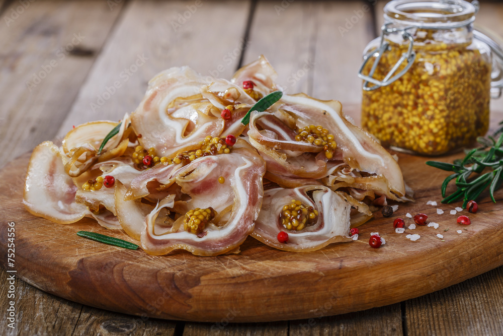 smoked pig ears cut with Dijon mustard Stock Photo | Adobe Stock