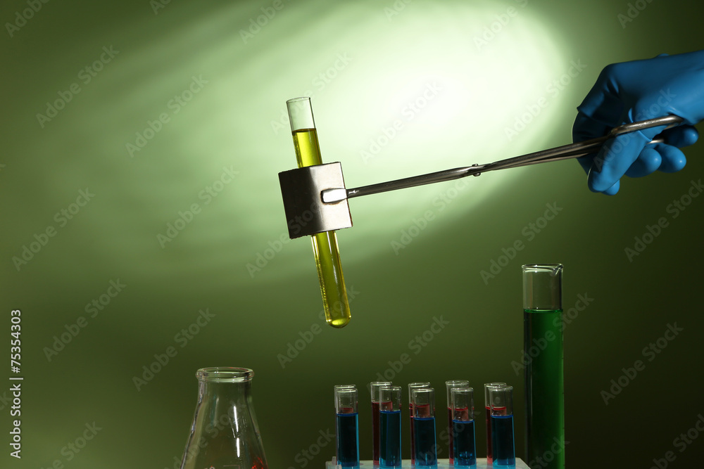 Laboratory glass test tube filled color liquid held in Stock Photo ...