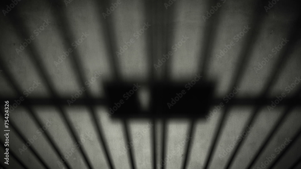 Prison cell door closing shadow on dark concrete jail floor Stock Video ...