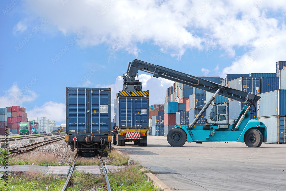forklift handling container box loading to freight train Stock Photo ...